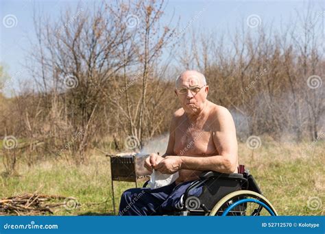 Handicap Senior Man On His Wheelchair At The Park Stock Photo Image
