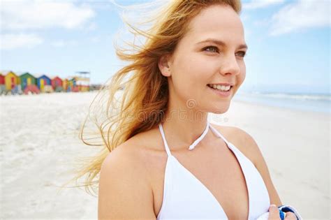 She Loves The Beach A Beautiful Young Woman Standing On The Beach