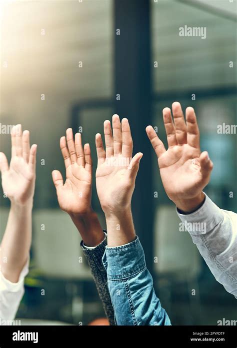 Pick Us A Group Of Unrecognizable Businesspeople Raising Their Hands