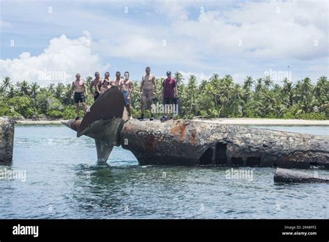 Us Military Personnel Standing On The Wreck Of The German Cruiser Prinz