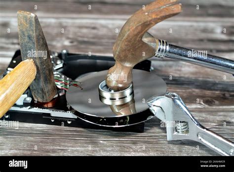 Spanner Wrench And Steel Hammers With Hdd Platters Hard Disk Drive