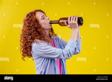 Curly Redhead Ginger Woman Drinking Beer And Feeling Bad Mood In Csudio