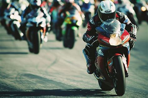 Man Riding Motorcycle On Curvy Road Premium Ai Generated Image