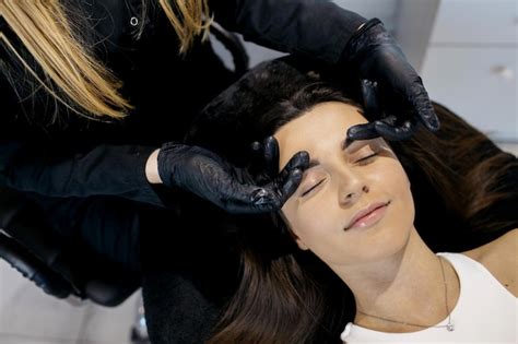 Premium Photo A Girl In A Beauty Salon A Girl Undergoing A Procedure