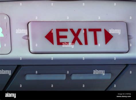 Exit Sign On An Airplane Stock Photo Alamy