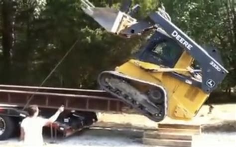 Watch The Precarious Unloading Of A Compact Track Loader