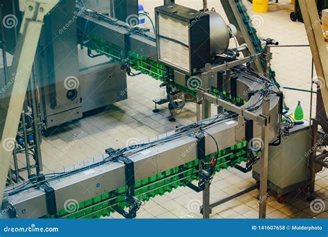 Automated Beer Bottling Production Line Empty Beer Bottles On Conveyor Belt Stock Photo Image