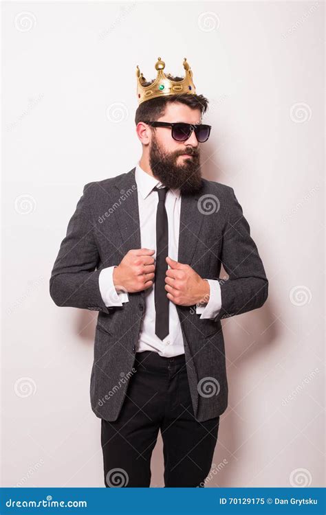 Young Handsome Man In Sunglasses Wearing Suit And Crown Keeping Hand On