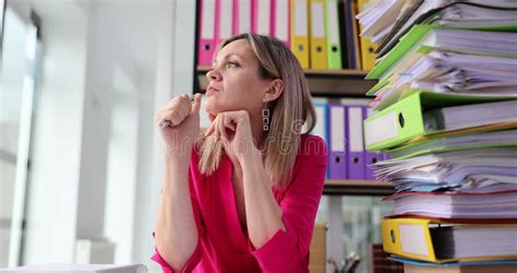 Thoughtful Female Employee Thinking About Project At Desk Stock Video