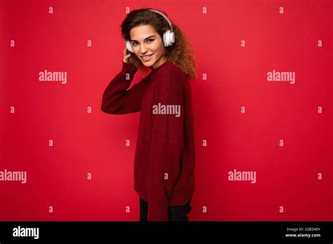 Side Profile Photo Of Attractive Positive Young Brunet Curly Woman