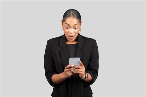 Premium Photo Surprised And Delighted Young Businesswoman Reads A