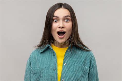 Astonished Woman With Widely Open Mouth In Amazement And Big Eyes
