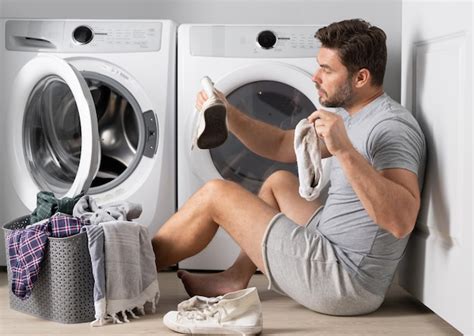 Premium Photo Man Doing Laundry At Home Near Washing Machine Husband