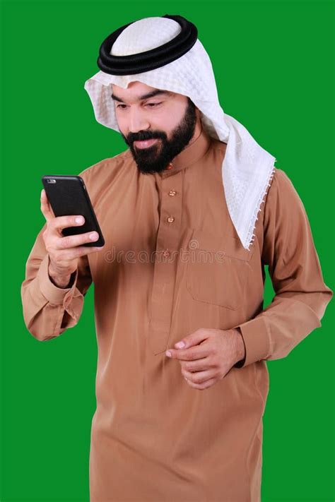 Portrait Of A Handsome Arab Man Smiling Welcoming Wearing Uae
