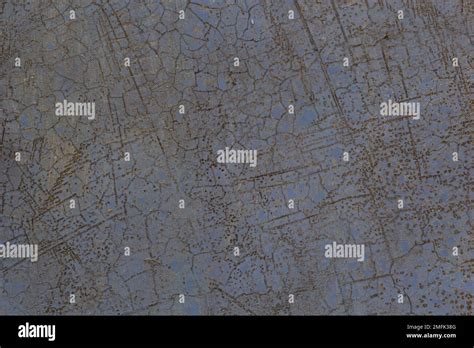 The Old Metal Surface Is Covered With Cracked Gray Paint With Rust Spots Stock Photo Alamy