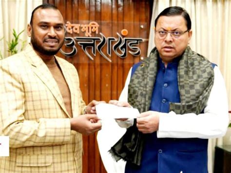 Rs 11 Lakh Check Handed Over To Cm Dhami Cracks In Houses Due To