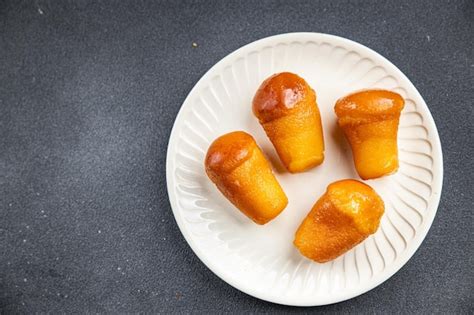 Premium Photo Baba Rum Sweet Alcohol Dessert Cake Meal Food Snack On The Table Copy Space Food