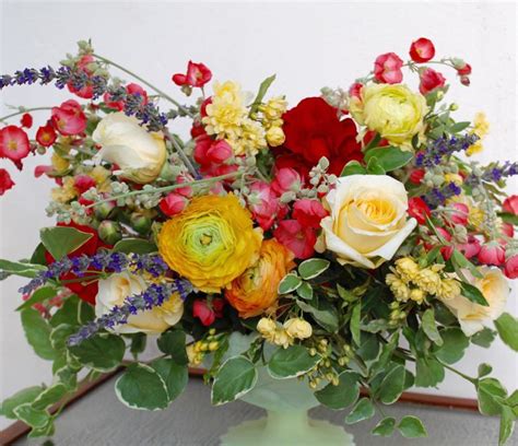 Garden Style With Yellow Ranunculus And Roses In A Vintage Vase