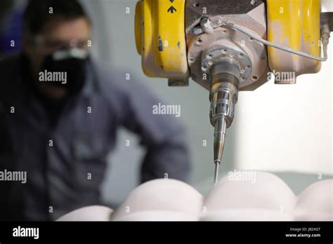 Worker Controlling A Multi Axis Milling Machine Stock Photo Alamy