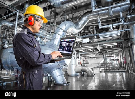 Engineer Using Laptop Computer In The Factory Stock Photo Alamy