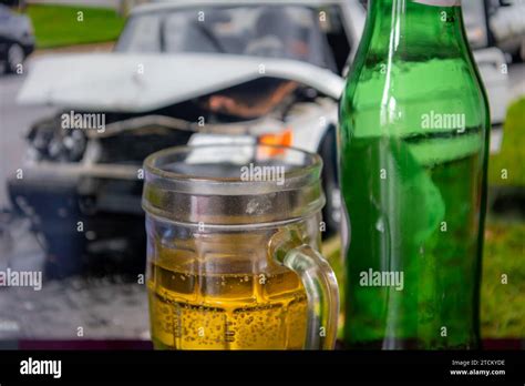 A Drink Driving Concept With A Pint And Bottles Of Beer And A Picture