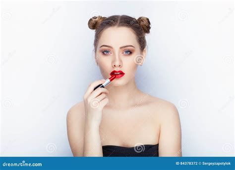 Young Pretty Woman Trendy Makeup Bright Red Lips Bun Hairstyle Bare