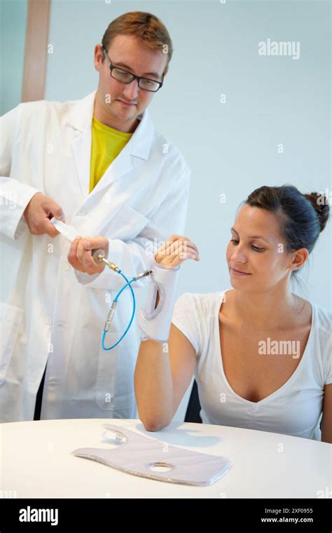 Researcher Placing A Patient Splint Prototype Built With Variable Stiffness Textile And