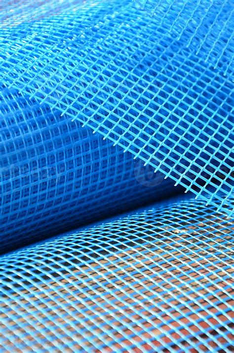 Close Up Texture Of A Blue Reinforcing Mesh Rolled Up In A Roll