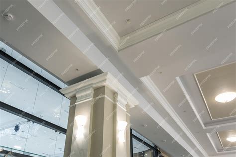 Premium Photo Suspended And Grid Ceiling With Halogen Spots Lamps And Drywall Construction In