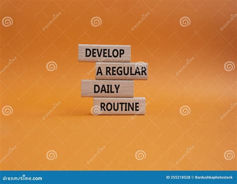 Develop A Regular Daily Routine Symbol Concept Words Develop A Regular Daily Routine On Wooden
