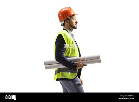Male Site Engineer With A Safety Equipment Carrying Blueprints Isolated