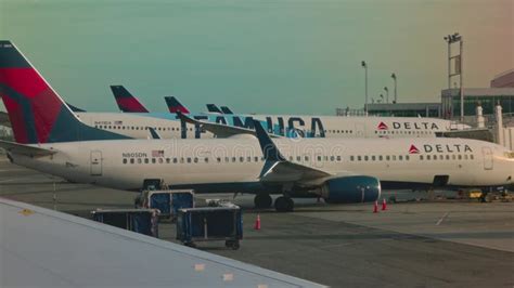 Views Of Multiple Delta Airlines Aircraft Parked From Window Of Taxiing