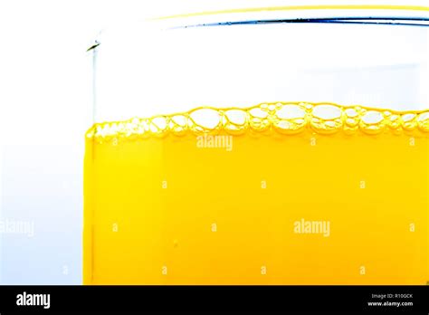 Bubbles Of Orange Soda In A Glass Closeup Macro Textured Background