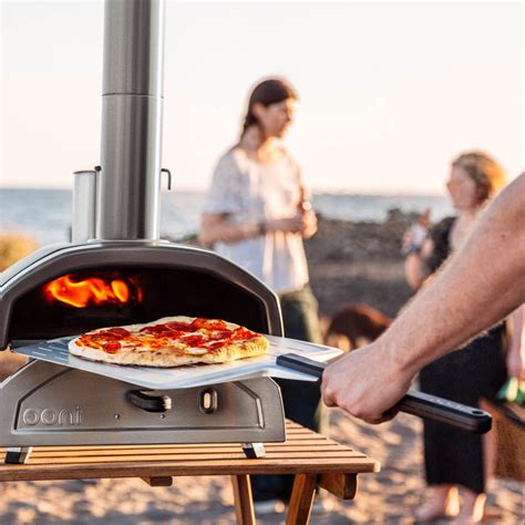 Ooni • Ooni Fyra 12 Portable Woodfired Pellet Outdoor Pizza Oven Deluxe