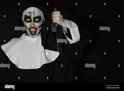 Scary Devilish Nun With Knife On Black Background Space For Text