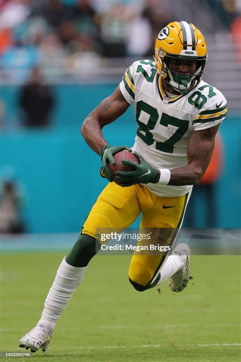 Romeo Doubs Of The Green Bay Packers Runs With The Ball During The