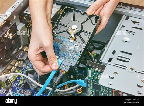 Plugging In Sata Data Cable To The Hard Disk Drive Of The Personal