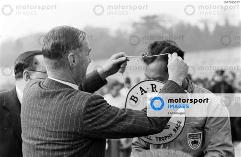Sir Malcolm Campbell Presents B Bira With The Winners Plaque After