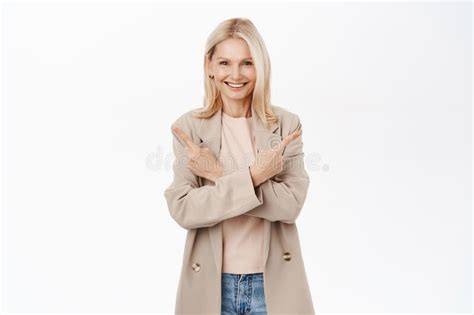 Portrait Of Beautiful Middle Aged Woman Pointing Fingers Left And Right