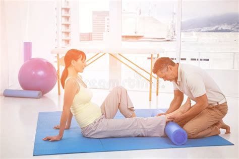 Physiotherapist Giving Physiotherapy To Pregnant Woman Stock Image