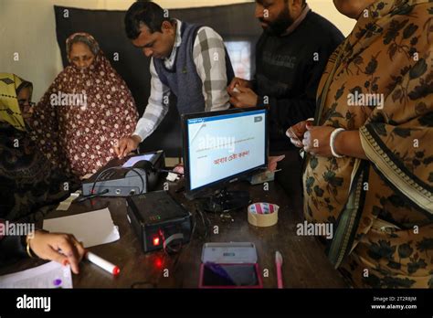 A Woman Casts Her Vote Using An Electronic Voting Machine Evm During