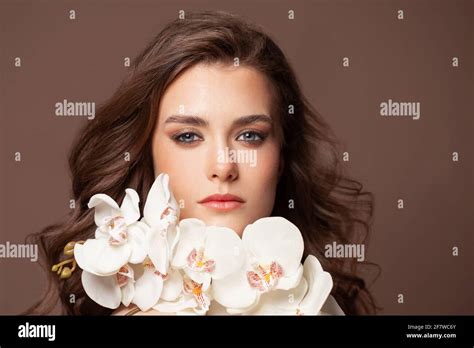 Beautiful Female Face With Healthy Brown Hair Clear Skin And White