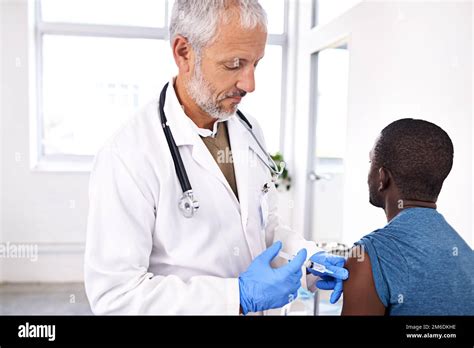 Prevention Is Better Than Cure A Mature Male Doctor Giving His Patient
