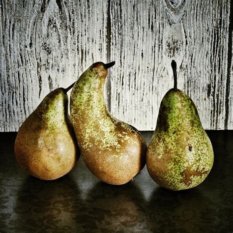 Premium Photo Still Life With Pears On A Wooden Background