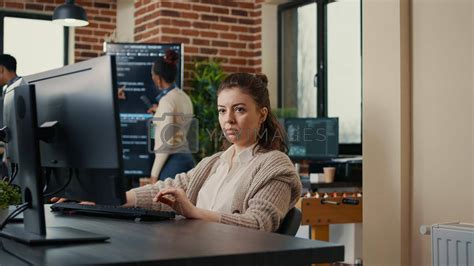Software Engineers Analyzing Code On Wall Screen Tv Looking For Bugs