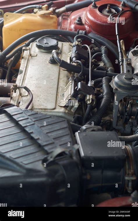 Side View Of Old And Used Four Cylinder Car Engine Or Motor Straight