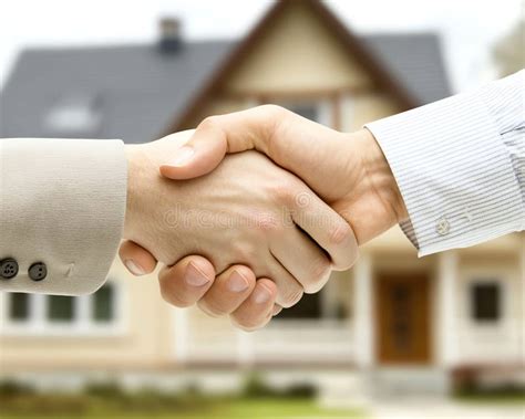 Successful Real Estate Deal Handshake Seals The Purchase Agreement For