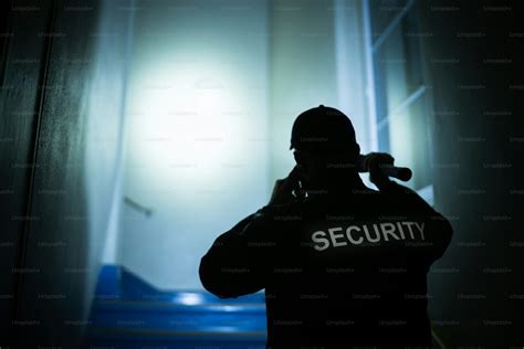 Security Guard Searching On Stairway With Flashlight Photo Office Image On Unsplash
