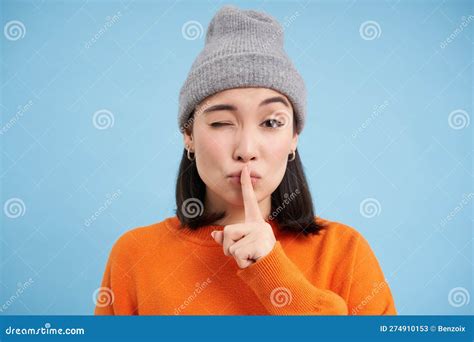 Shh Its Secret Close Up Portrait Of Asian Woman In Hat Puts Finger On