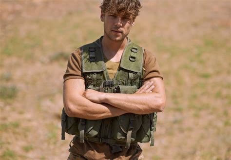 Confident In His Abilities A Handsome Soldier Looking At The Camera